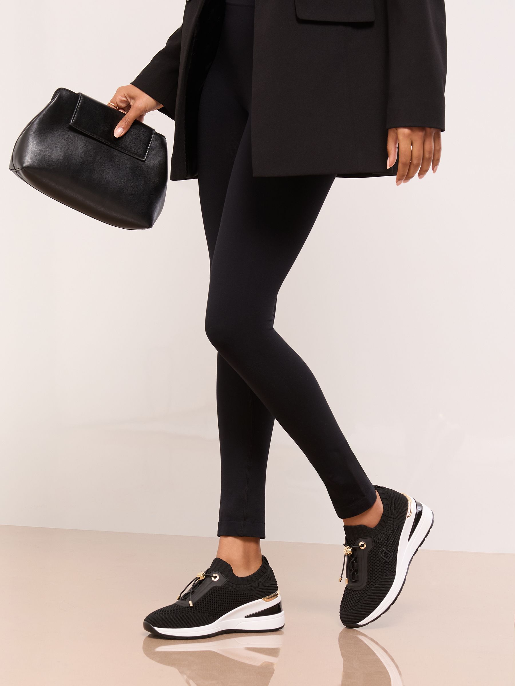 Buy Lipsy Black Standard Fit Mid Wedge Knit Runner Sports Trainners ...