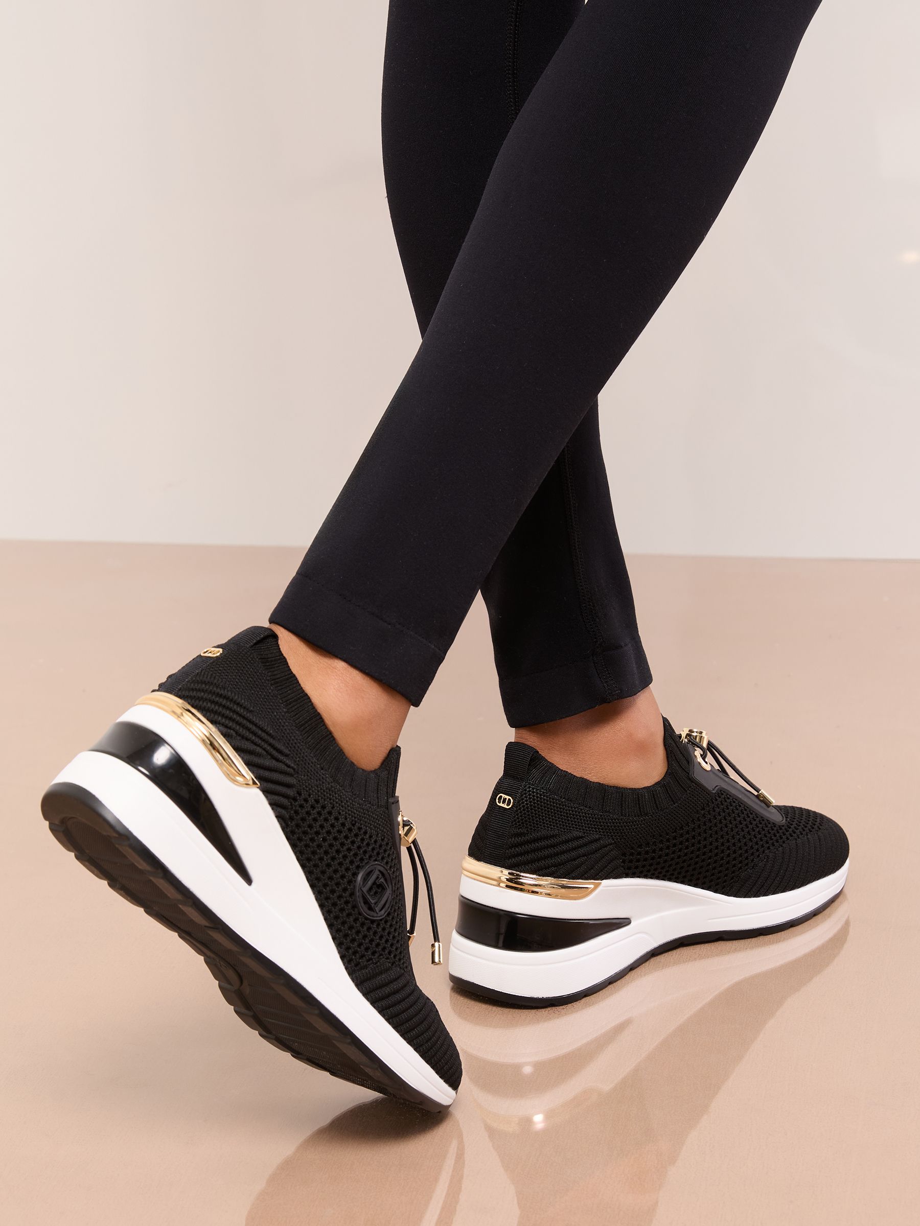 Buy Lipsy Black Standard Fit Mid Wedge Knit Runner Sports Trainners ...