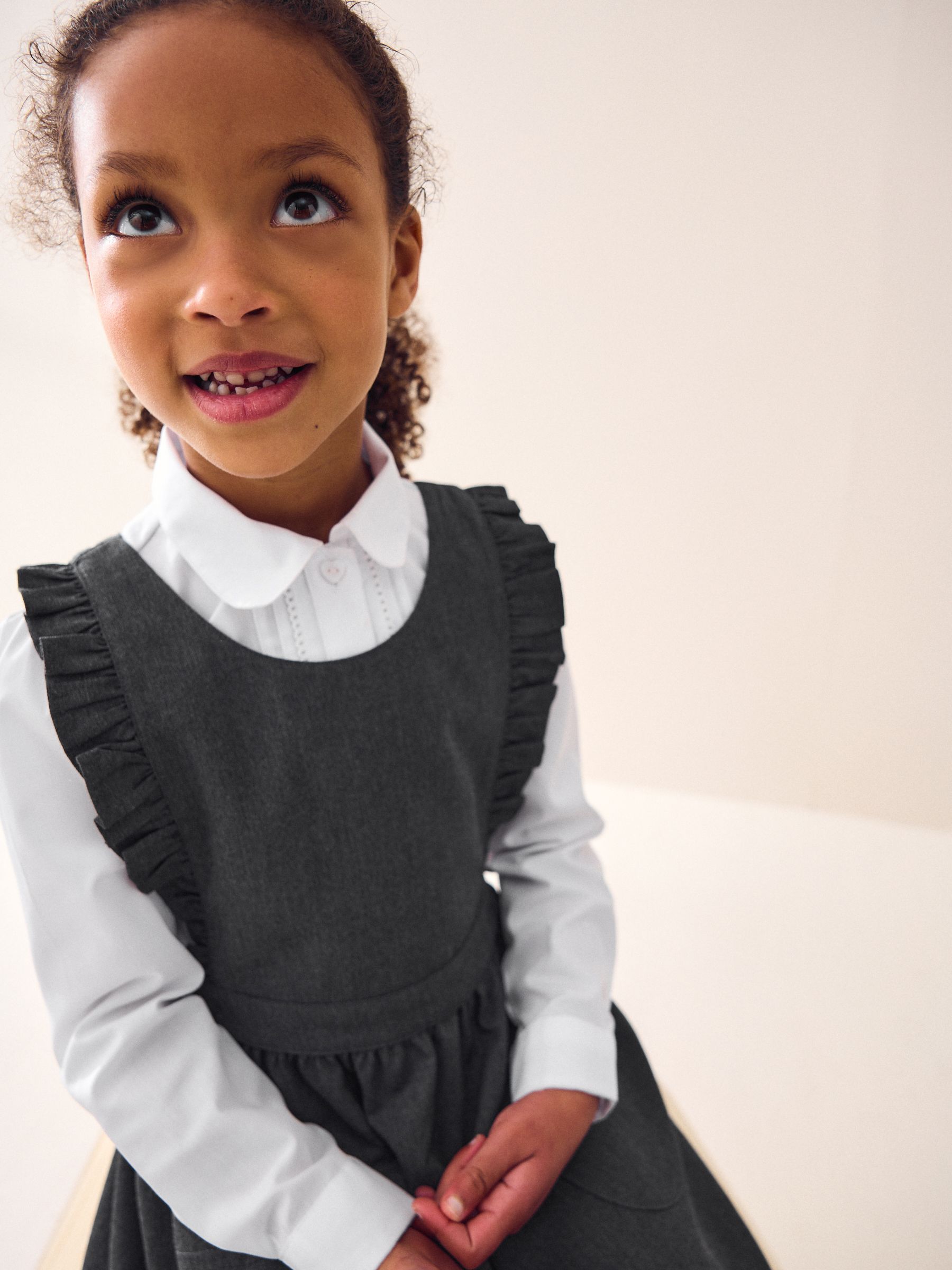 Buy Grey Ruffle Detail Pinafore School Dress (3-14yrs) from the Next UK ...