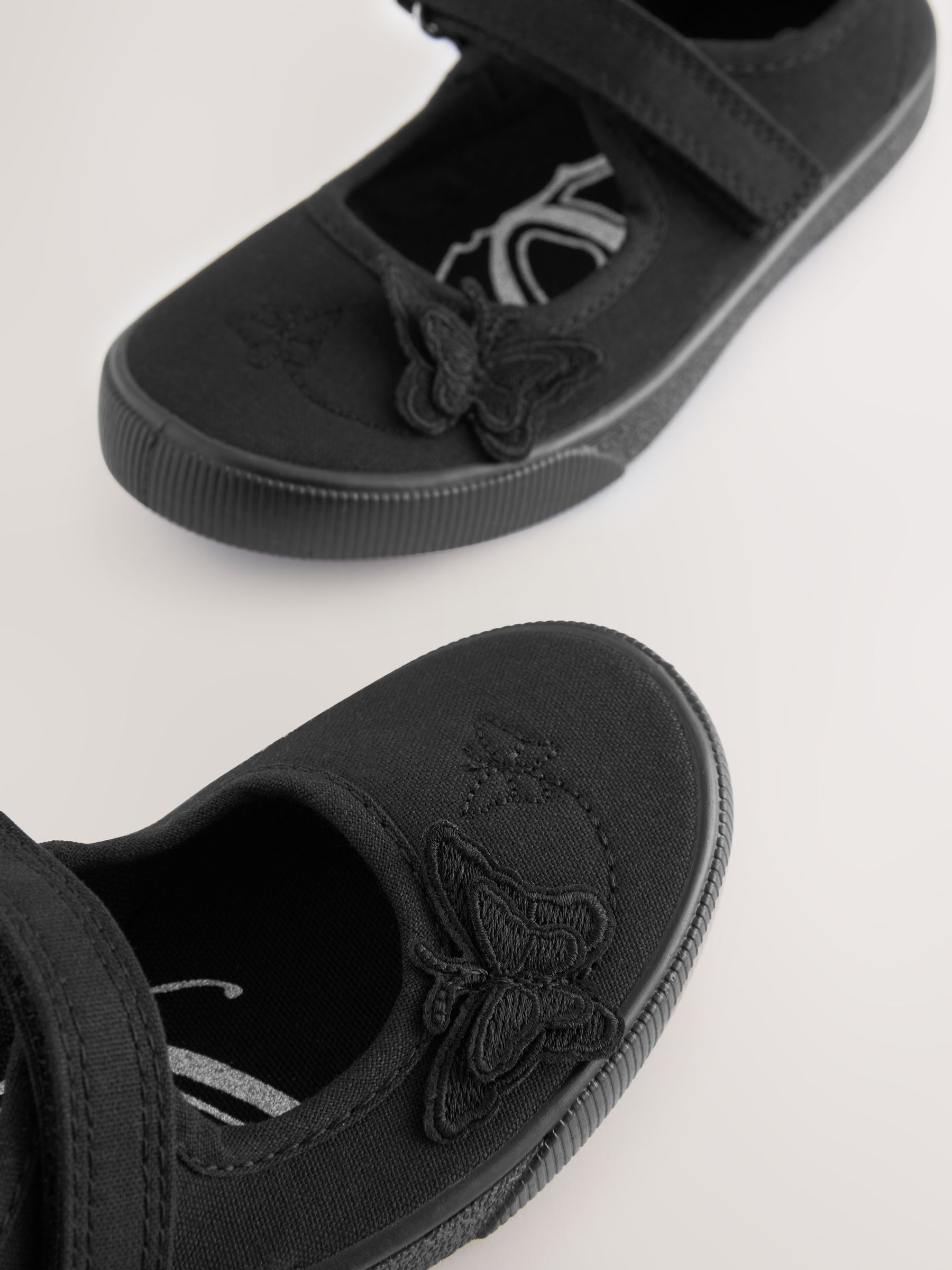 Buy Black - Butterfly Embroidered School Plimsoll Shoes from Next Poland