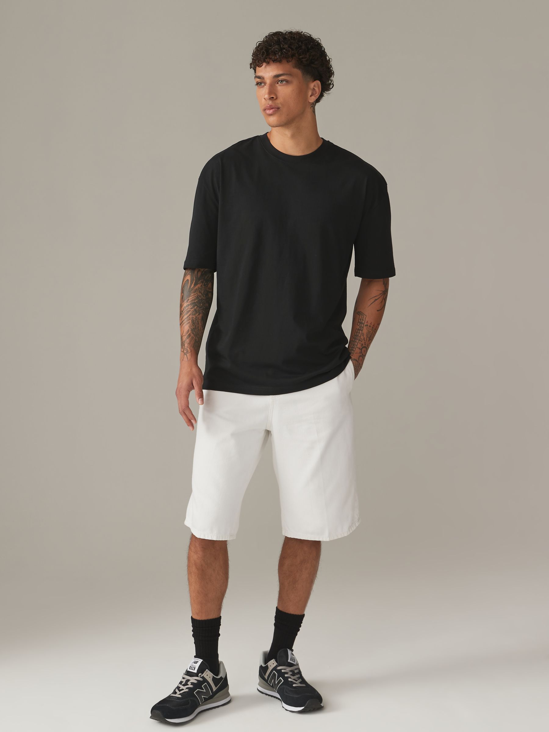 Buy Black Essential Cotton T-Shirts Relaxed Fit 5 Pack from Next Saudi ...