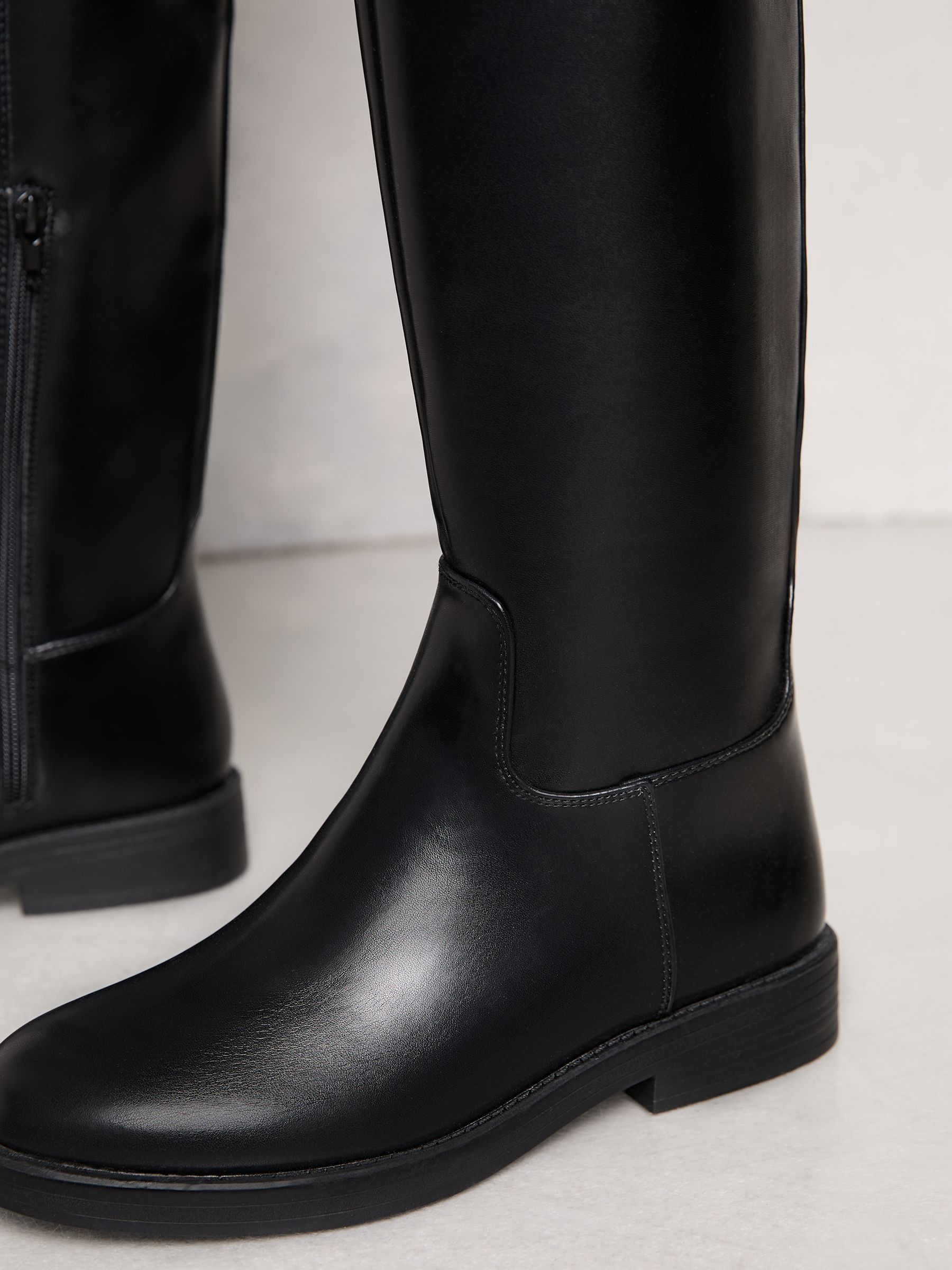 Buy Lipsy Black Standard Fit Flat Long Knee High Faux Leather Riding ...