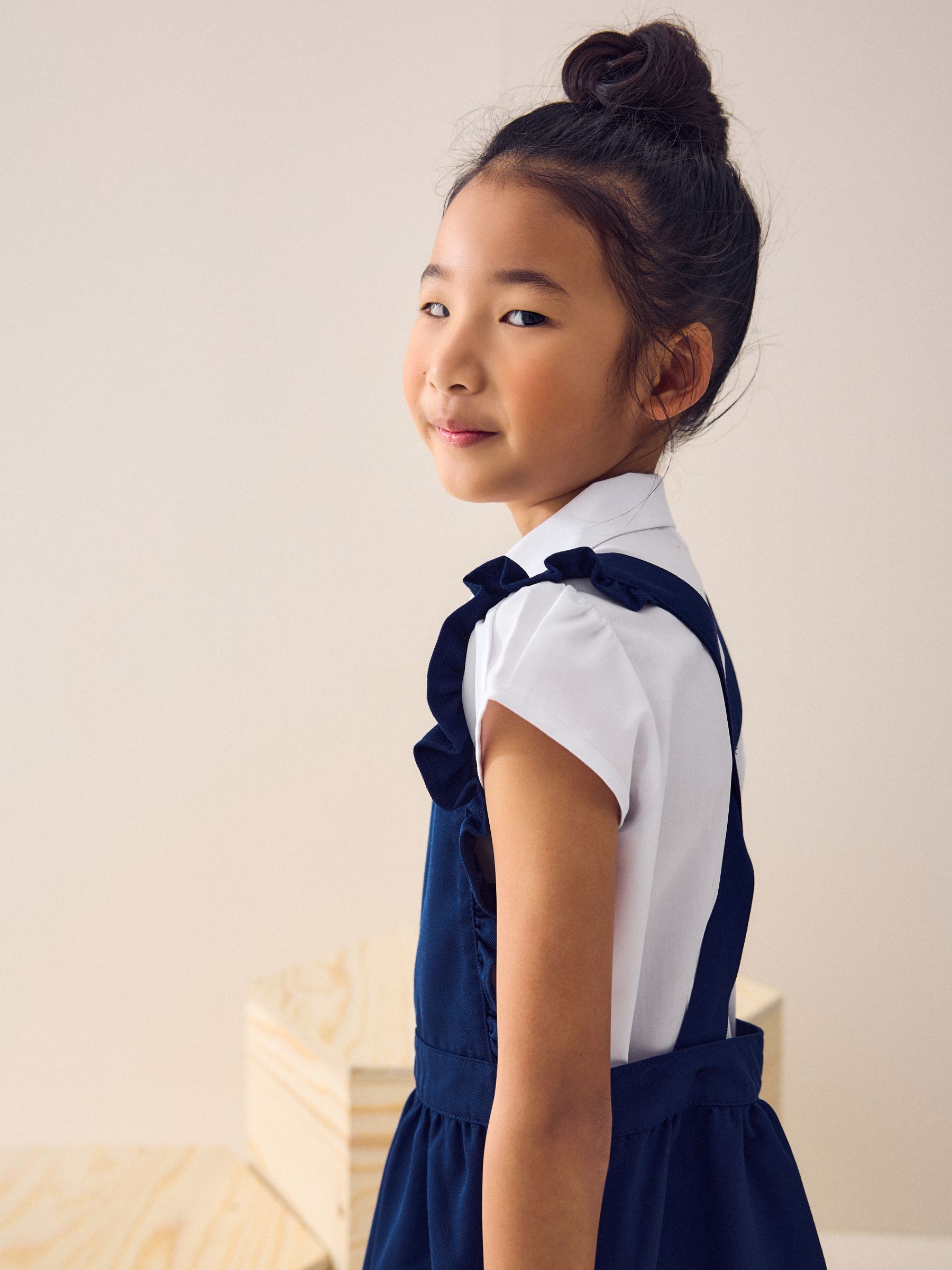 Buy Bright Blue Ruffle Detail Pinafore School Dress (3-14yrs) from the ...