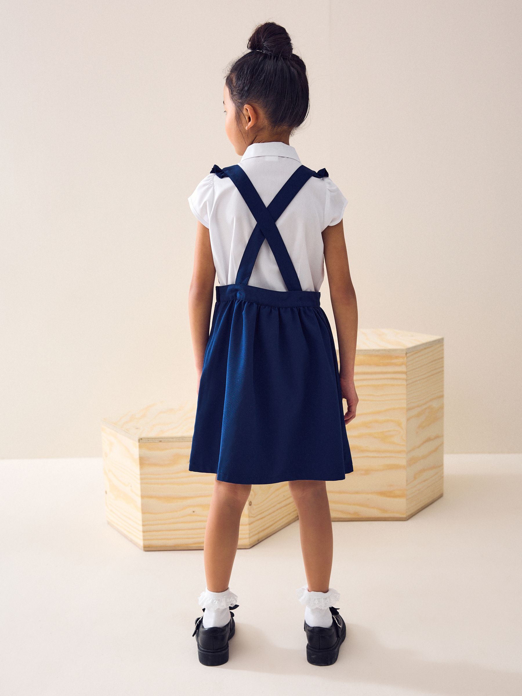 Buy Bright Blue Ruffle Detail Pinafore School Dress (3-14yrs) from the ...