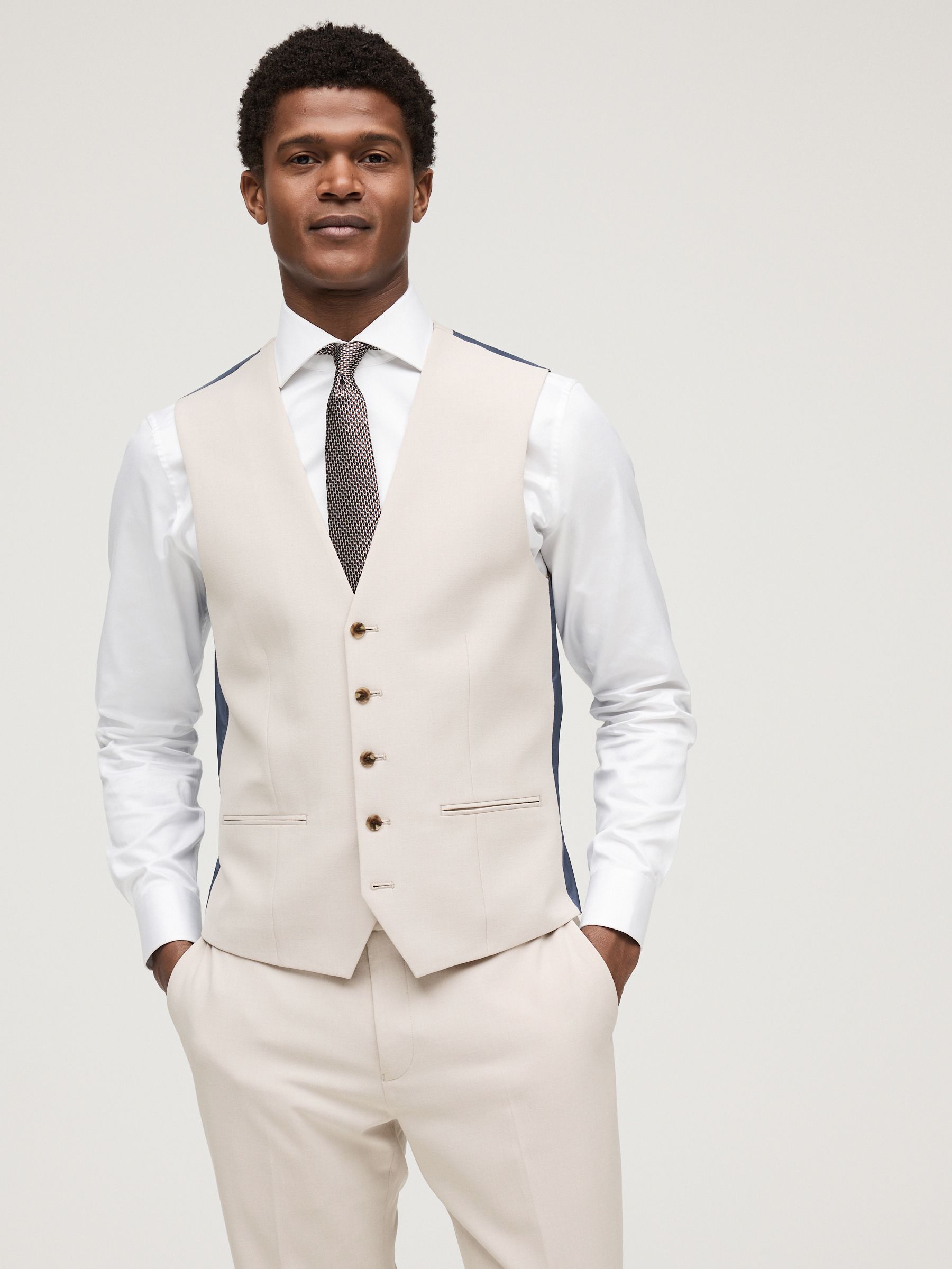 Buy Neutral Regular Fit Motionflex Stretch Waistcoat from the Next UK ...