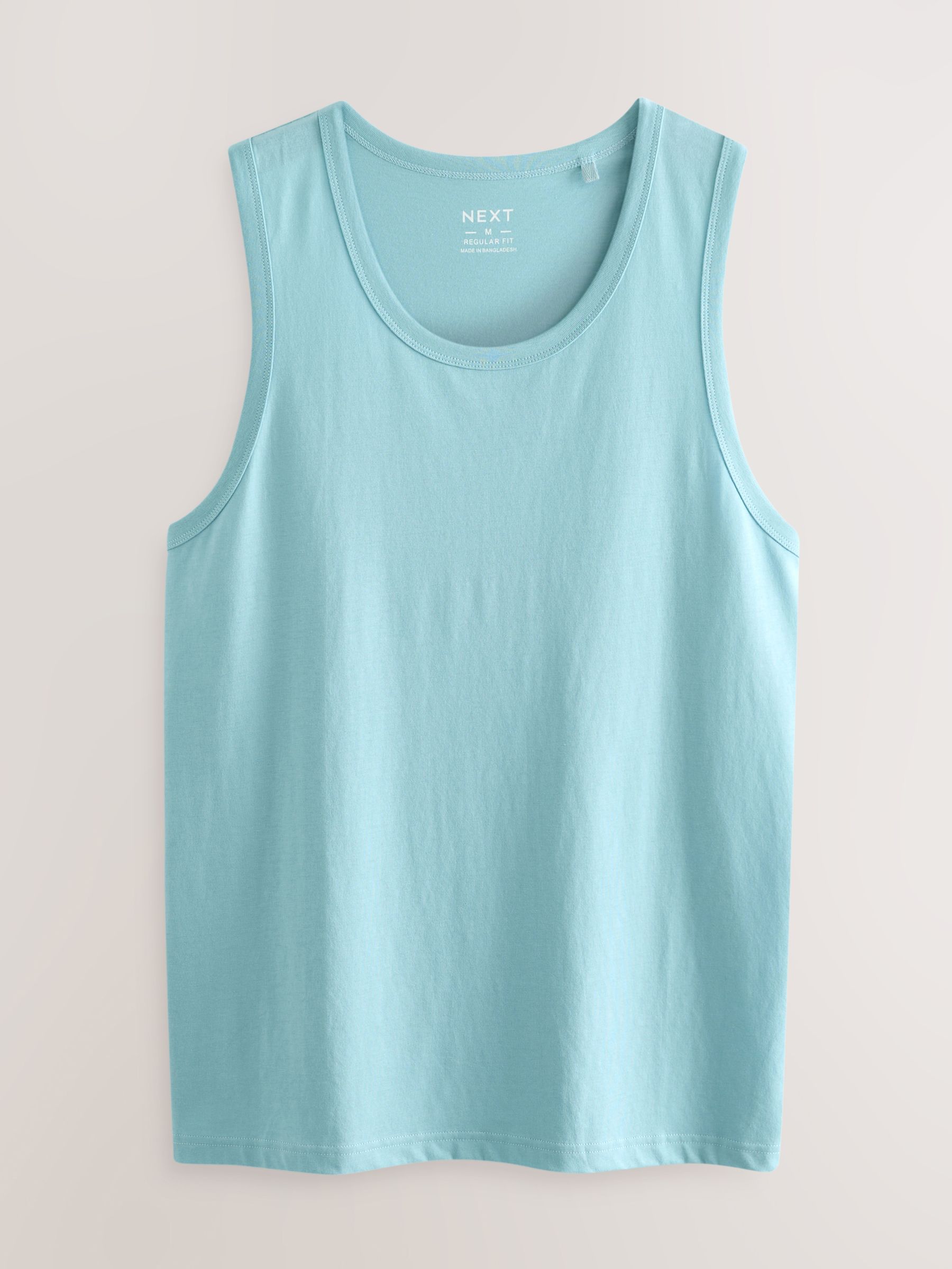 Buy Black/Navy/White/Blue Cotton Vests 4 Pack from the Next UK online shop