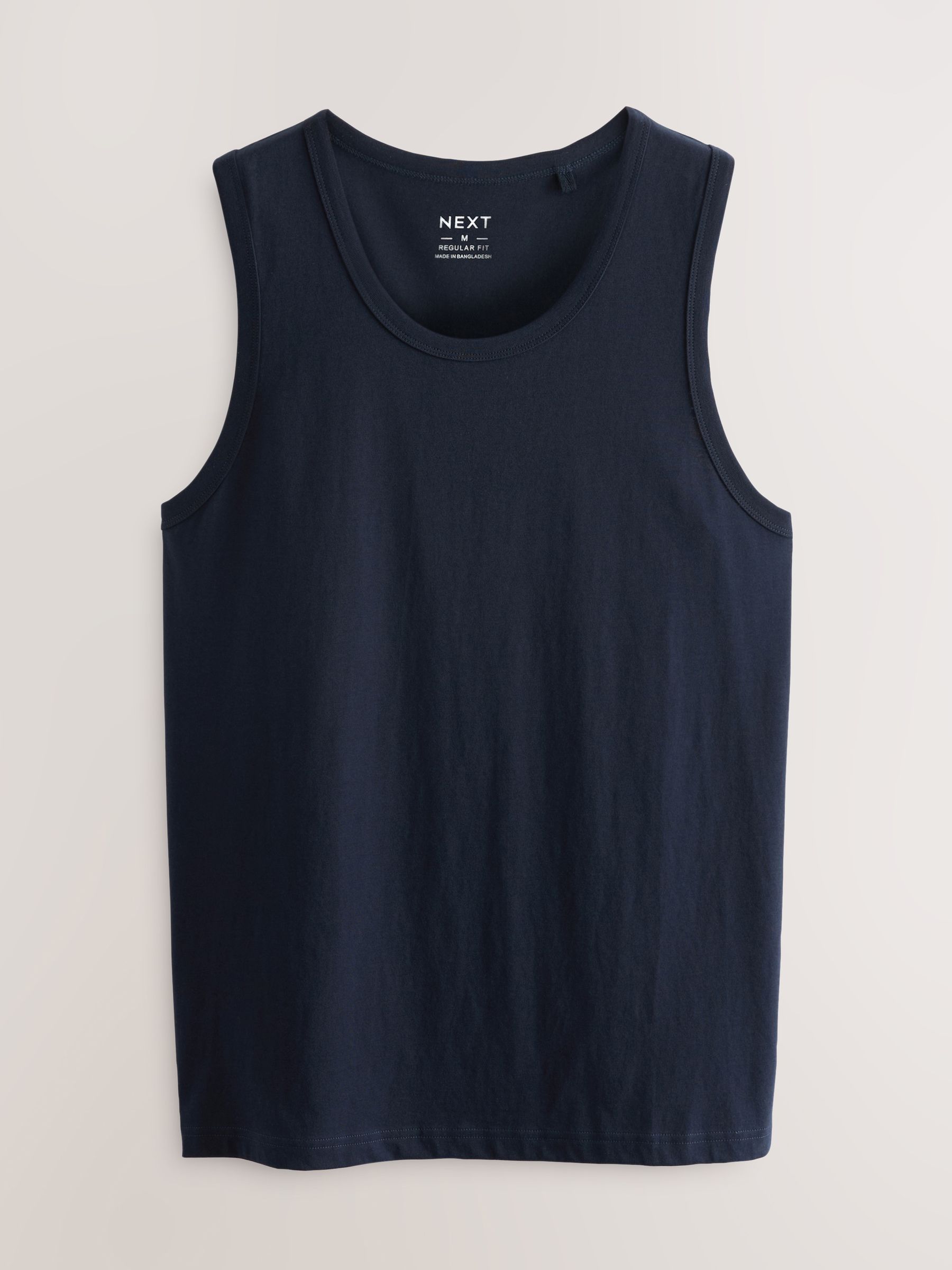 Buy Black/Navy/White/Blue Cotton Vests 4 Pack from the Next UK online shop