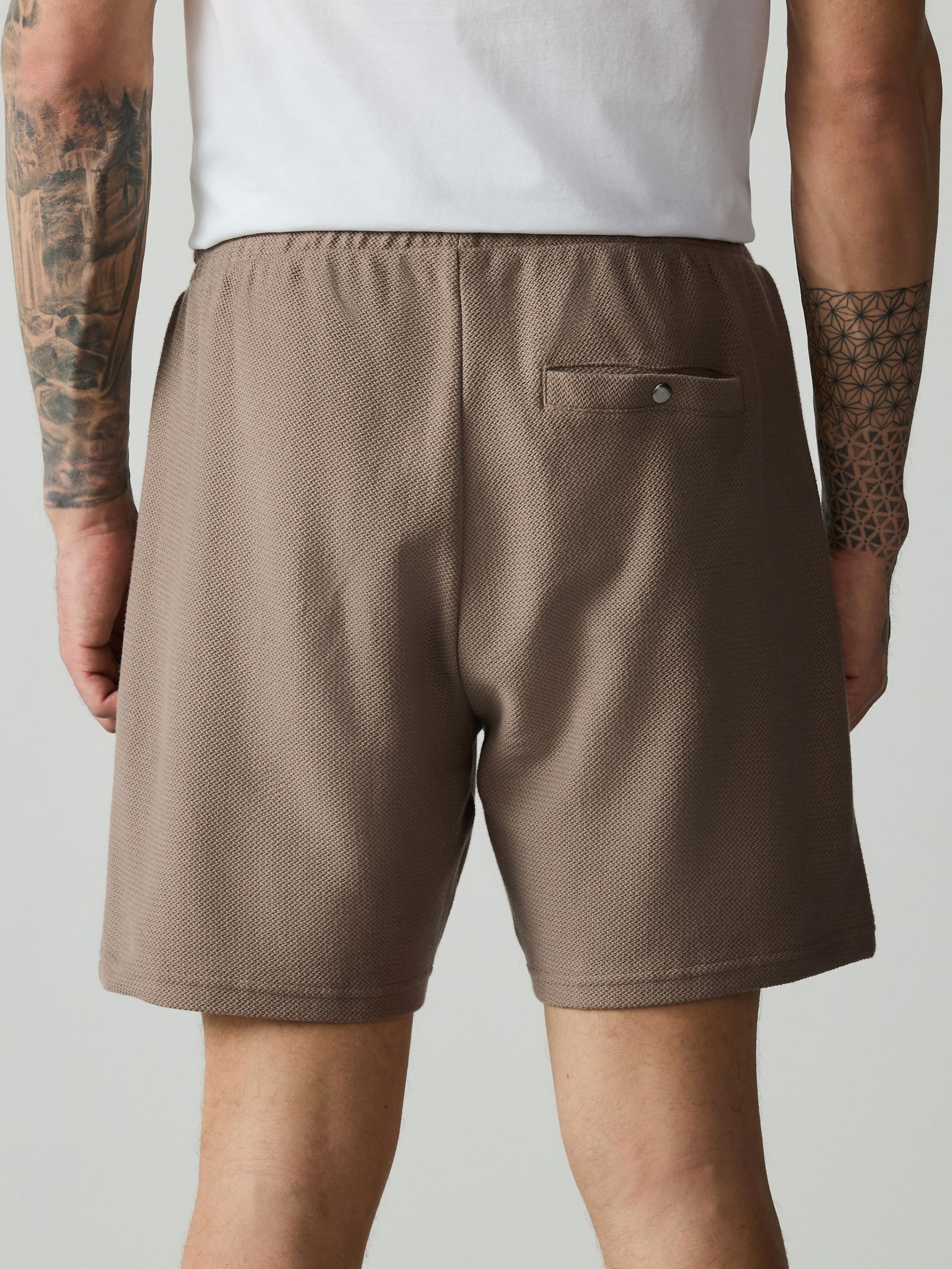 Buy Light Brown Textured Pintuck Jersey Shorts from Next Italy