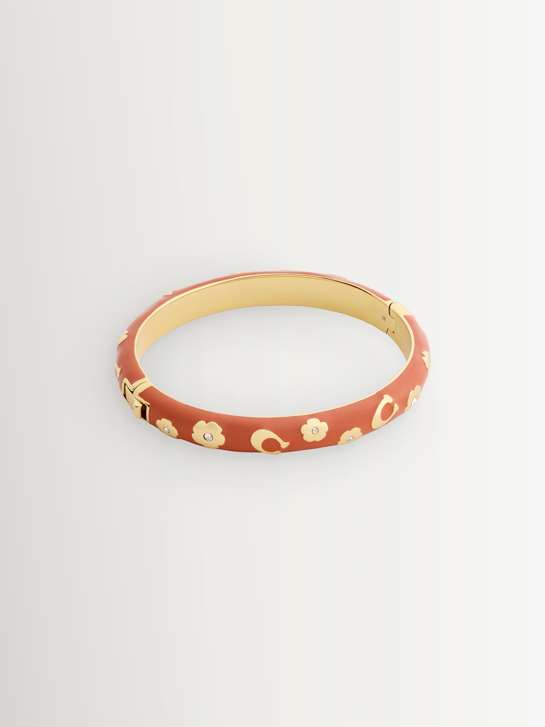 Buy COACH Gold Tone Signature C Floral Chubby Bangle Bracelet from the ...