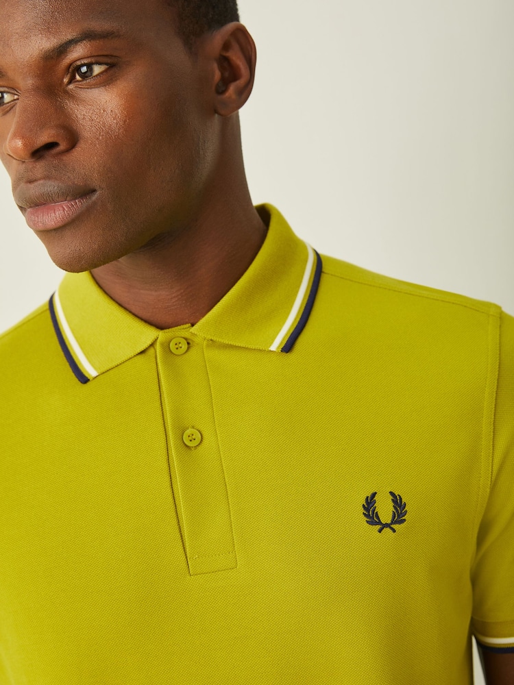 Buy Fred Perry Yellow Twin Tipped Polo Shirt from Next Germany