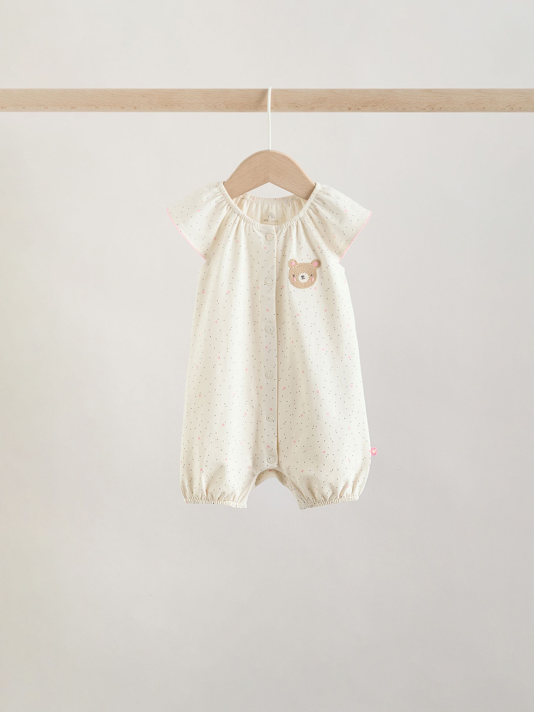 Buy Pink Character All Over Printed Button Through Jersey Baby Rompers ...