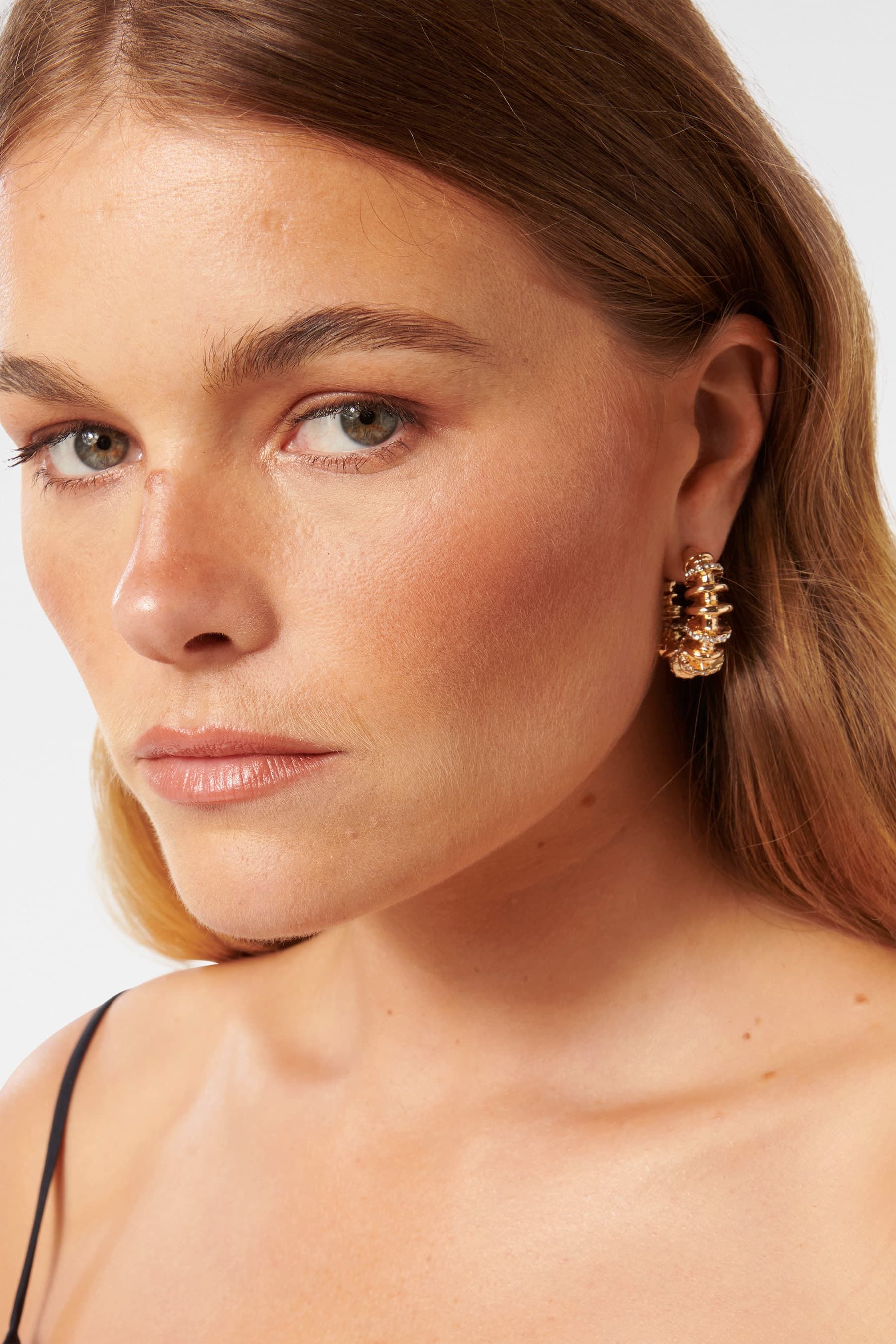 Buy Forever New Gold Tone Signature Sakura Stone Swirl Hoop Earrings from the AspennigeriaShops online shop