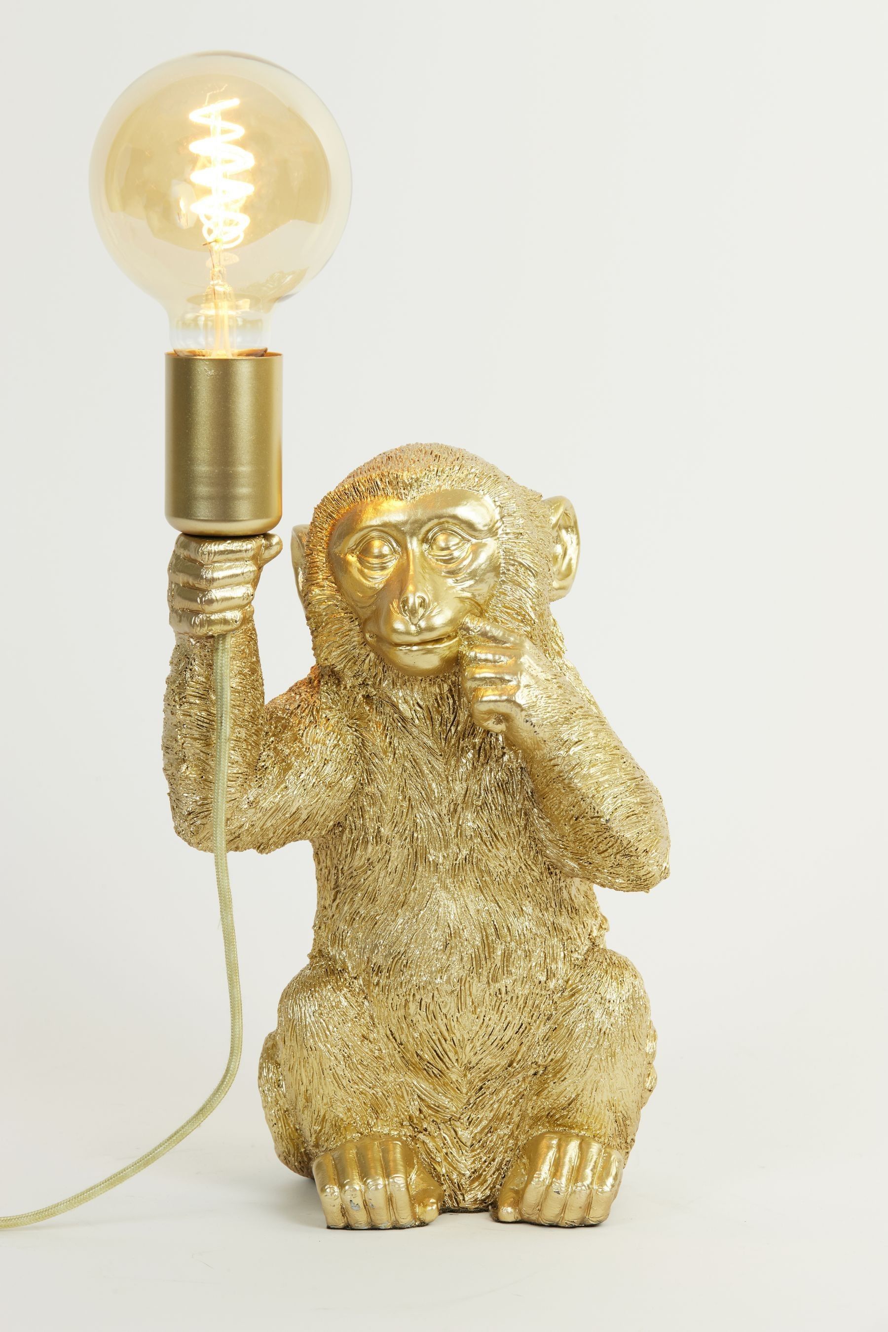 Buy Light & Living Gold Monkey Table Lamp from the Next UK online shop