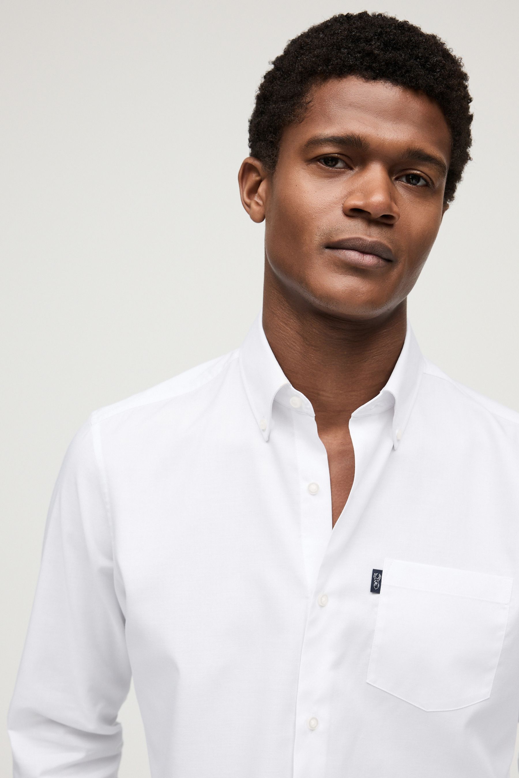 Buy White Slim Fit Easy Iron Button Down Oxford Shirt from the Next UK ...