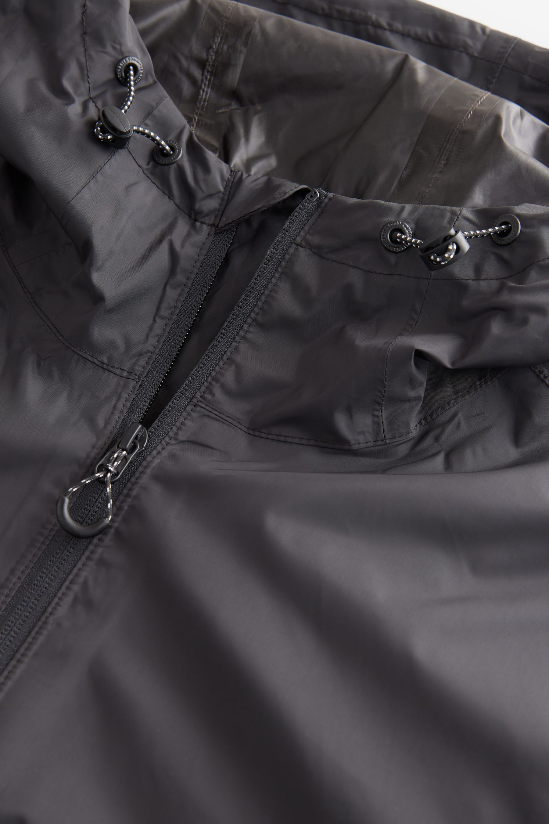 Buy Black Lightweight Waterproof Packable Hooded Jacket from the Next ...