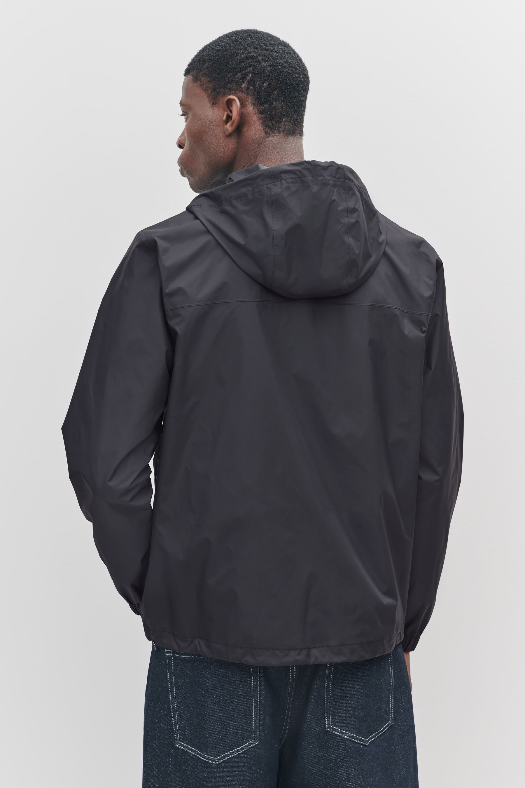 Buy Black Lightweight Waterproof Packable Hooded Jacket from the Next ...