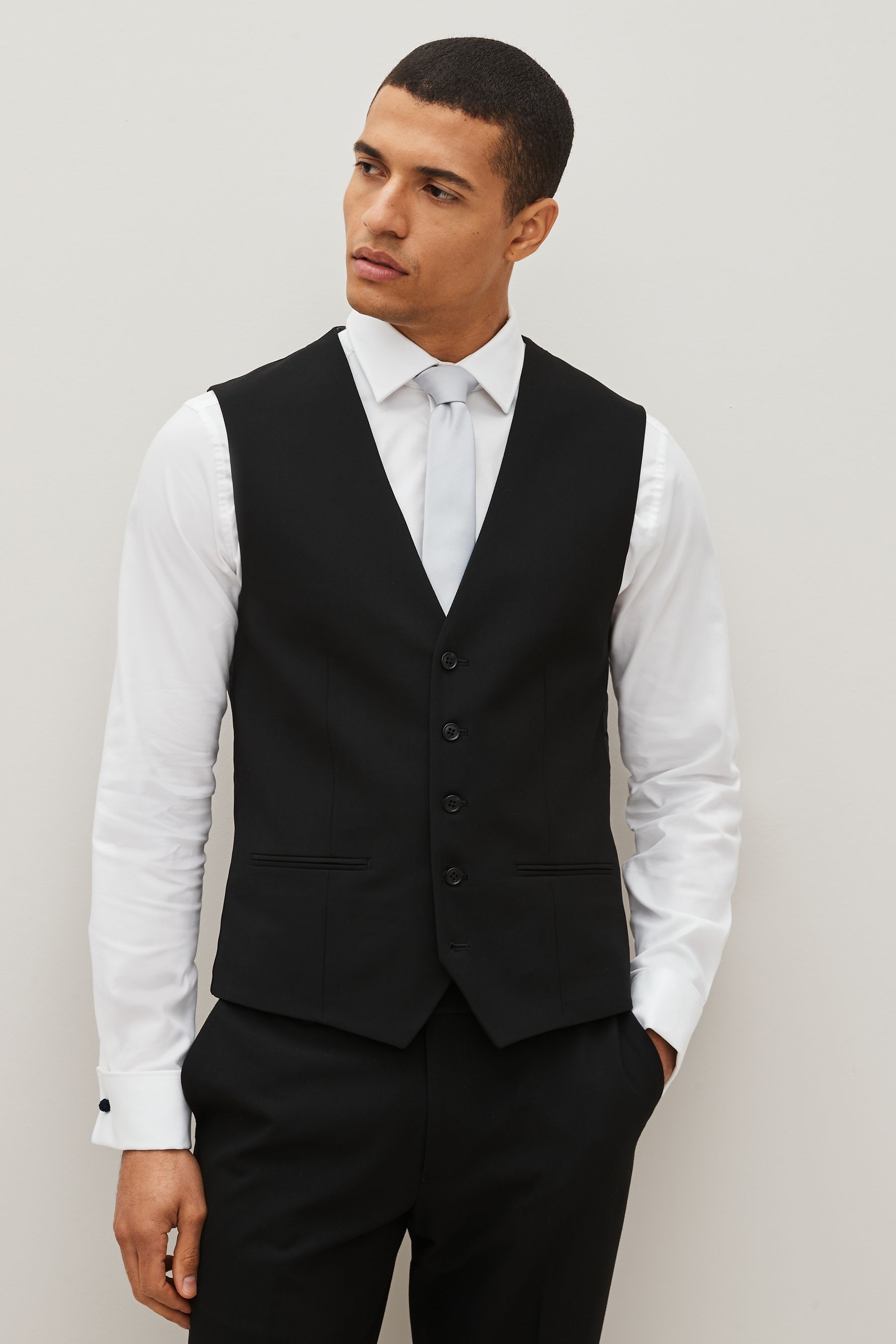 Buy Black Regular Fit Motionflex Stretch Waistcoat from the Next UK ...