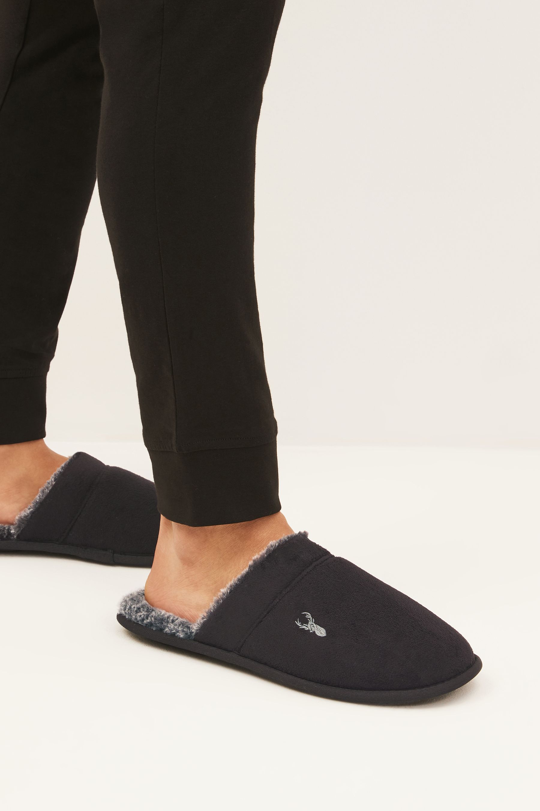 Buy Black Stag Faux Fur Lined Mule Slippers from the Next UK online shop