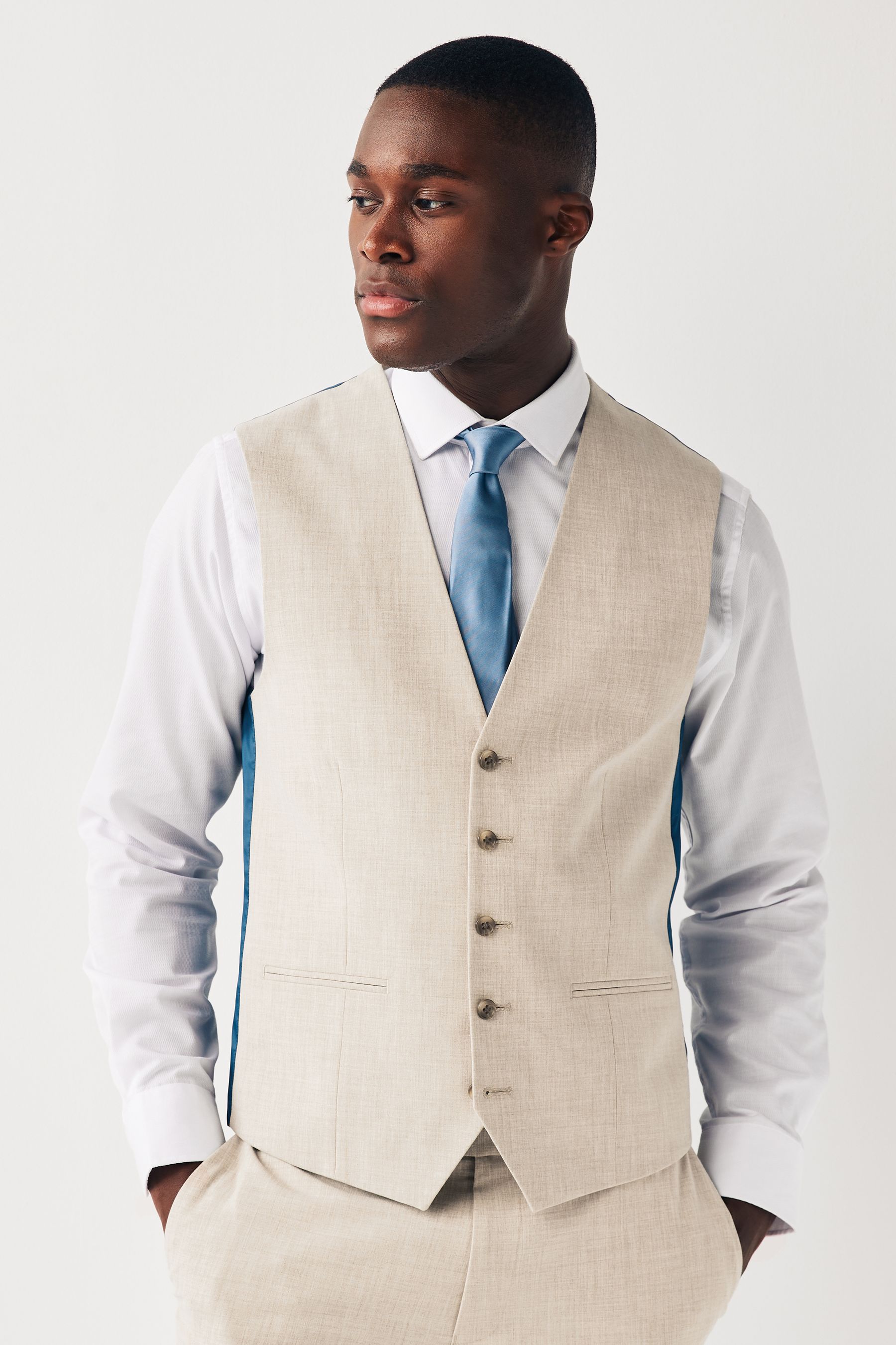 Buy Stone Regular Fit Motionflex Stretch Waistcoat from the Next UK ...